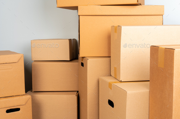Close up photo of a stack of moving boxes Stock Photo by FabrikaPhoto