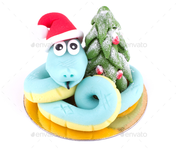 Marzipan snake and Christmas tree candy isolated on white background ...