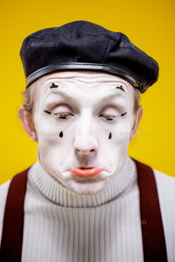 Portrait of a pantomime on the yellow background Stock Photo by RossHelen