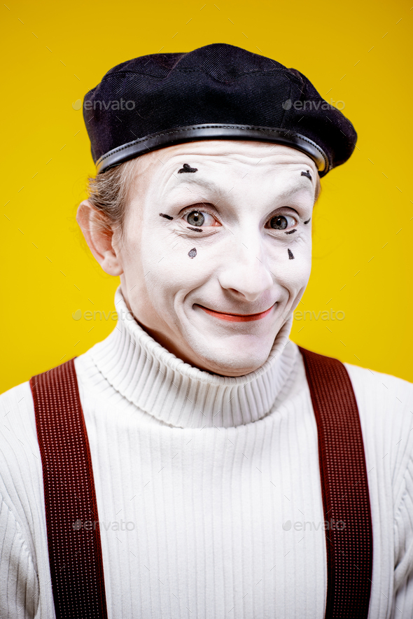 Portrait of a pantomime on the yellow background Stock Photo by RossHelen