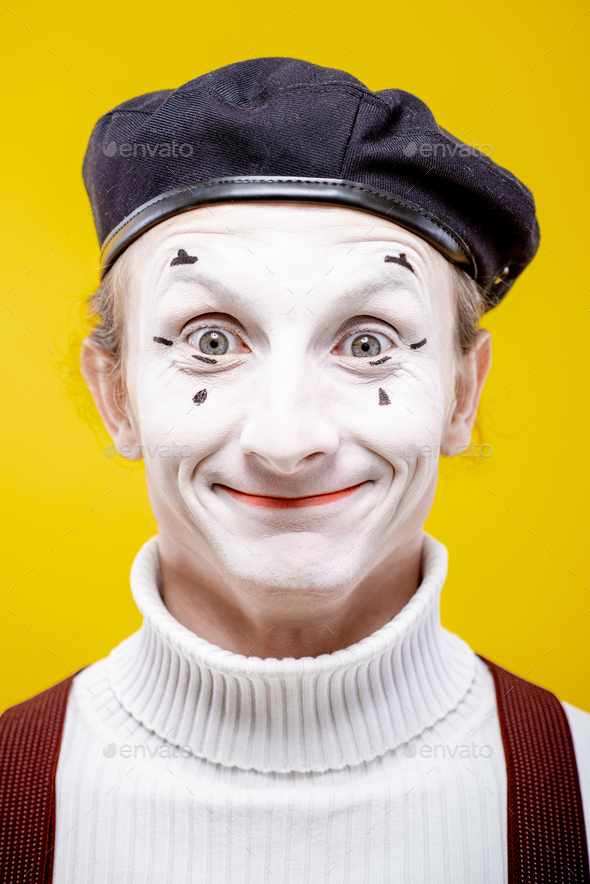 Portrait of a pantomime on the yellow background Stock Photo by RossHelen