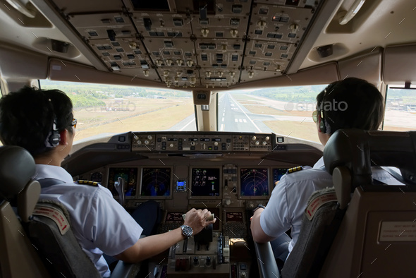Two pilots flying the airplane with full landing configuration to the ...