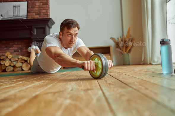 Man using outfit for exercising core indoors Stock Photo by ...