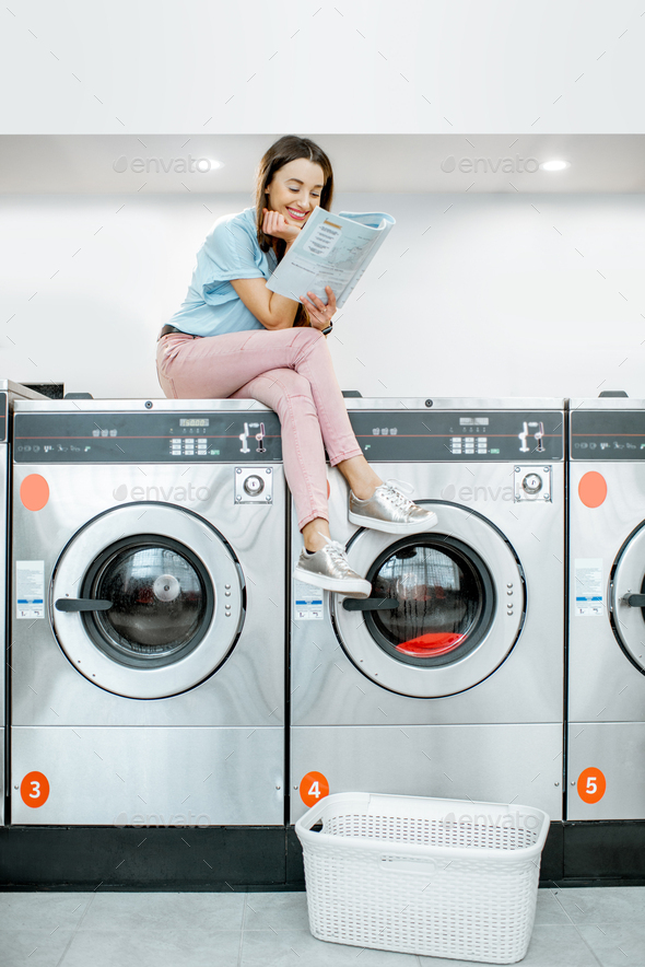 Woman in the laundry Stock Photo by RossHelen | PhotoDune