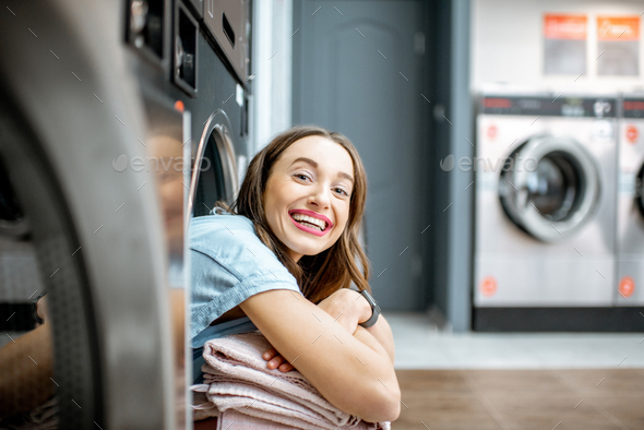 Woman in the laundry Stock Photo by RossHelen | PhotoDune