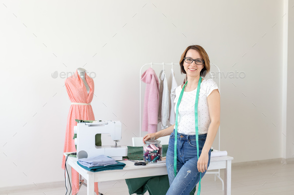Dressmaker, fashion designer and tailor concept - Portrait of young ...