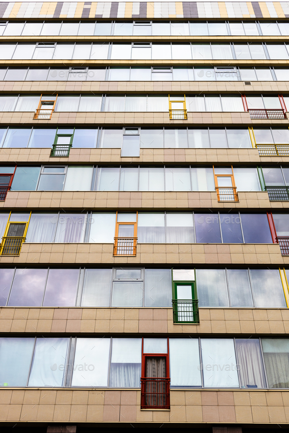 high-rise apartment building with glazed balconies Stock Photo by vvoennyy