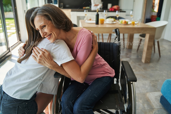 Relative maintaining and helping female person at home Stock Photo by ...
