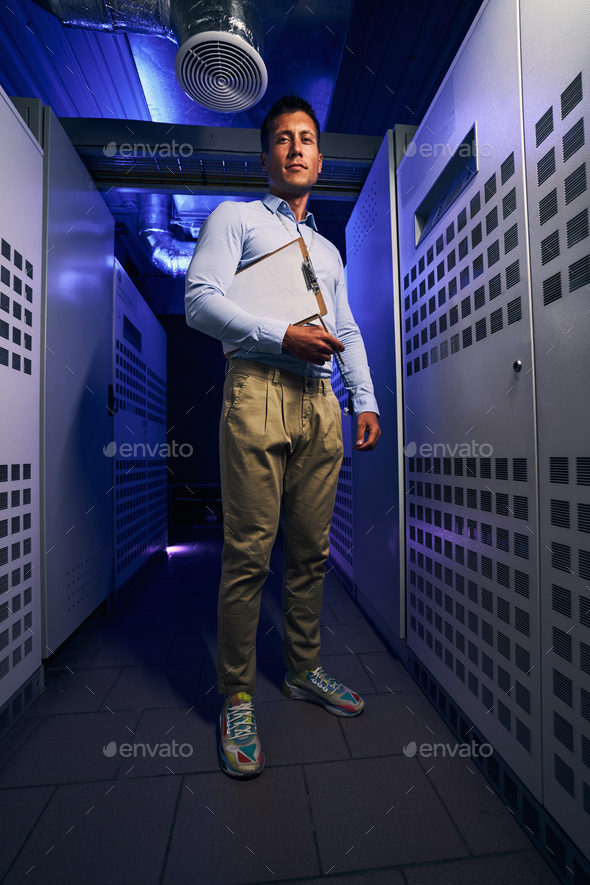 Data center technician posing for camera in workplace Stock Photo by ...