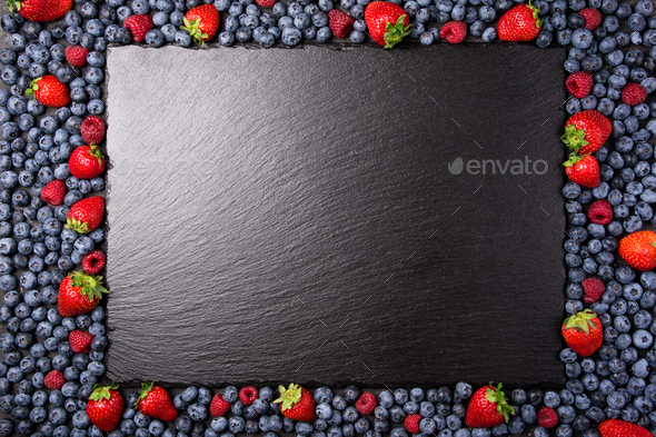 Frame with berries assorted mix of strawberry, blueberry, raspberry ...