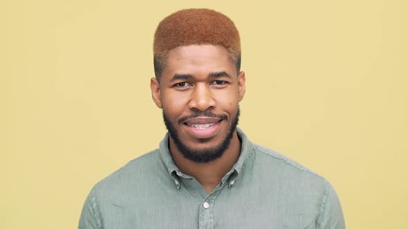 Slow Motion Picture of Metis Man with Dyed Hair in Red Looking at ...