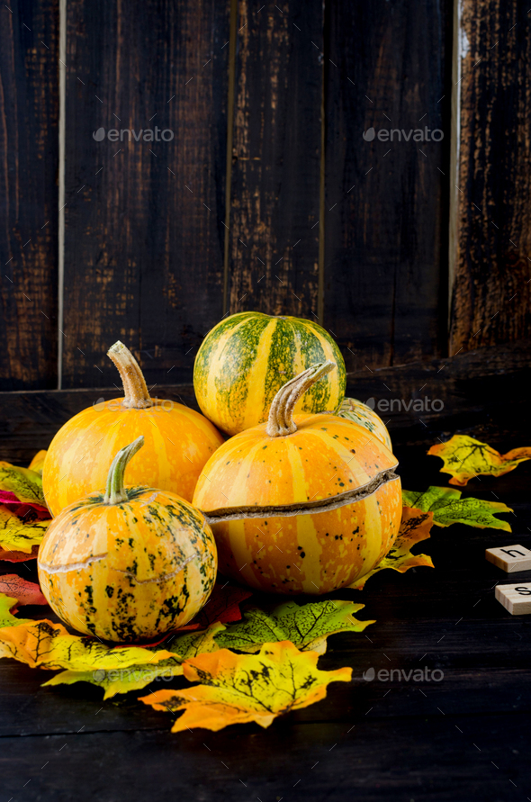 autumn dark background with pumpkins and leaves Stock Photo by ...