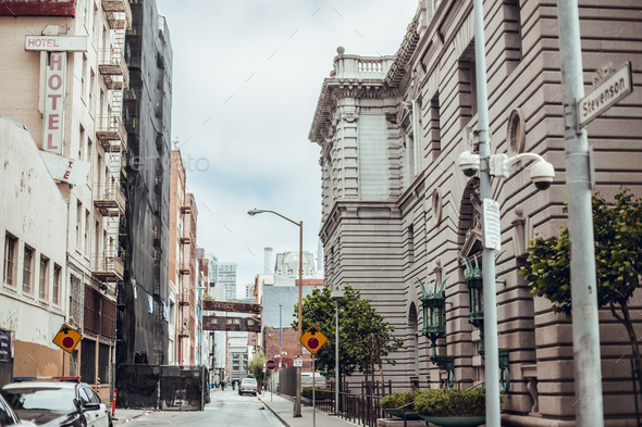 City street with buildings in summer Stock Photo by ADDICTIVE_STOCK