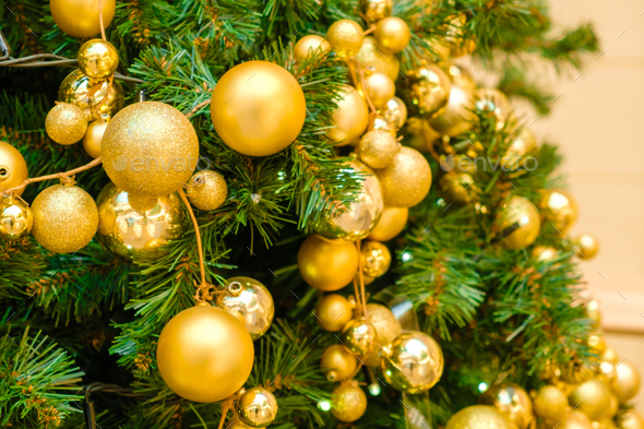 Christmas tree decorated with golden balls Stock Photo by Rimidolove