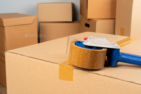 Close up photo of a stack of moving boxes Stock Photo by FabrikaPhoto