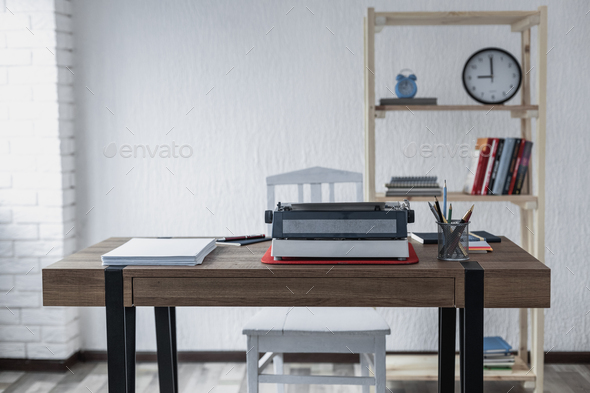 Vintage old typewriter at wooden desk table. Writer or screenwriter ...