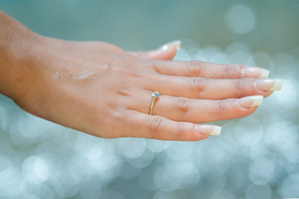 wedding ring on the girl's finger Stock Photo by Omelnickiy | PhotoDune
