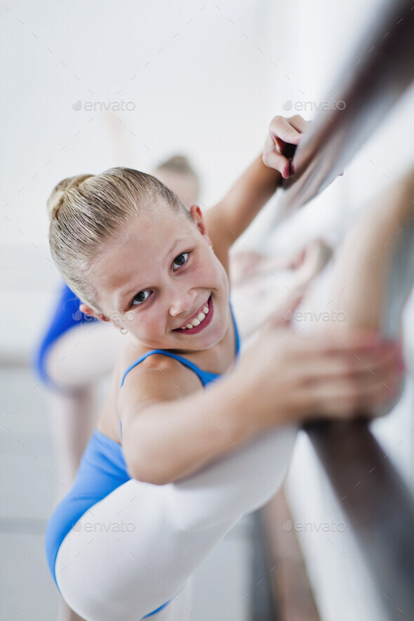 Ballet dancer stretching at barre Stock Photo by ImageSourceCur | PhotoDune