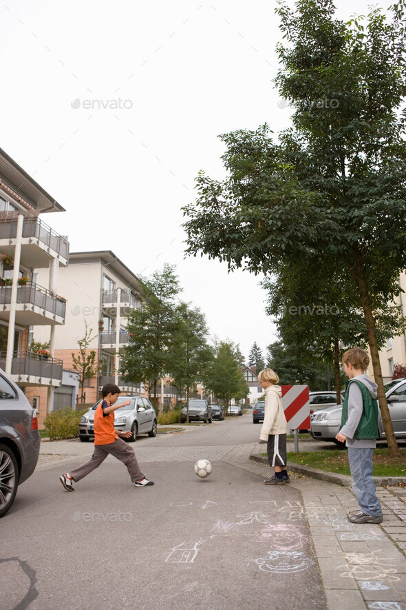 Children playing on suburban street Stock Photo by nualaimages | PhotoDune