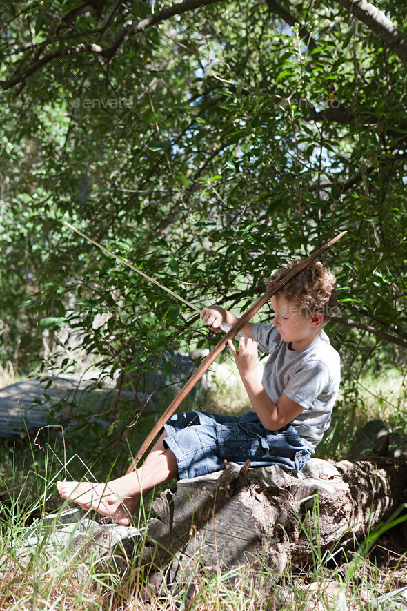 Boy with bow and arrow Stock Photo by nualaimages | PhotoDune