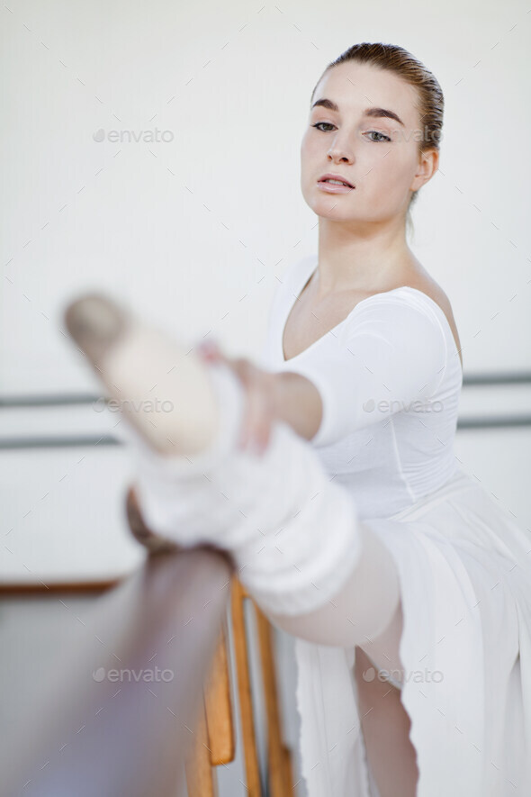 Ballet dancer stretching at barre Stock Photo by ImageSourceCur | PhotoDune