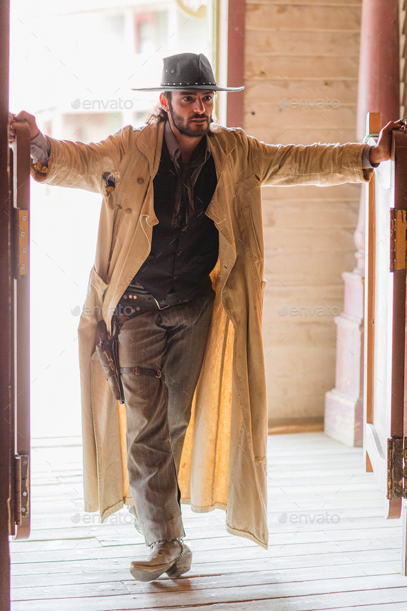 Cowboy standing in saloon doorway on wild west film set, Fort Bravo ...