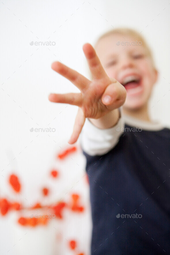 Boy pointing four fingers Stock Photo by nualaimages | PhotoDune