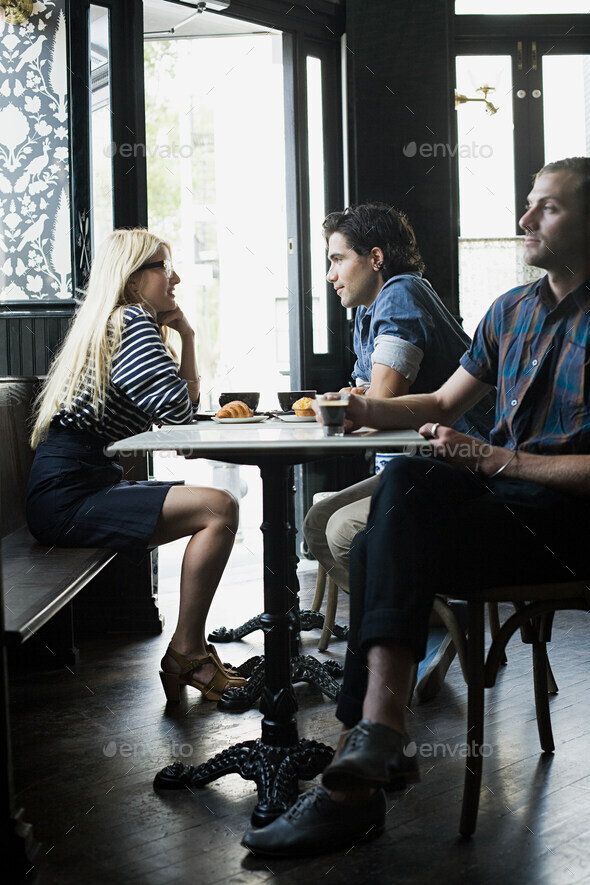 People having coffee in cafe Stock Photo by nualaimages | PhotoDune