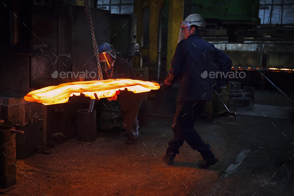 Flight bar (mining component) having been forged in a 15 MT counterblow hammer, is moved to ...