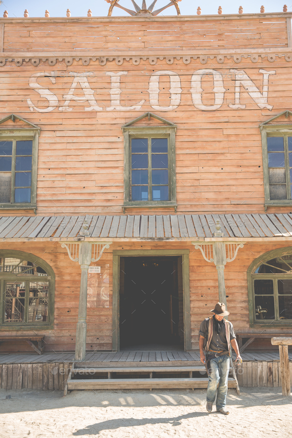 Cowboy in front of saloon building on wild west film set, Fort Bravo ...