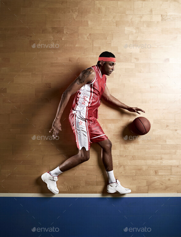 Basketball player laying on court Stock Photo by nualaimages | PhotoDune