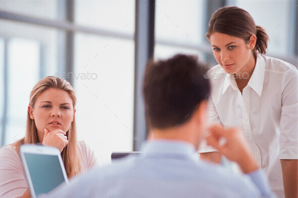 Business people talking at desk Stock Photo by nualaimages | PhotoDune