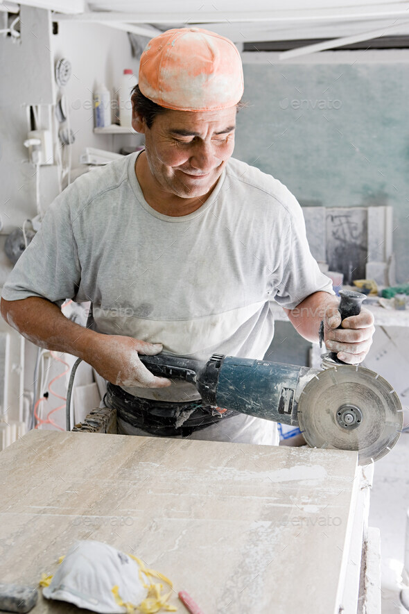 Man using circular saw Stock Photo by nualaimages | PhotoDune