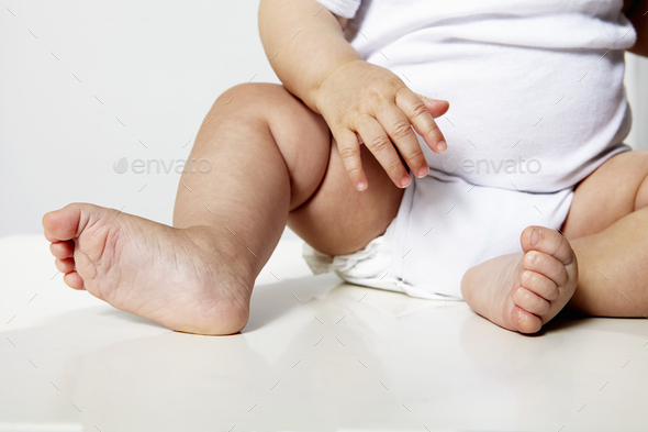 Baby's legs, low section Stock Photo by nualaimages | PhotoDune