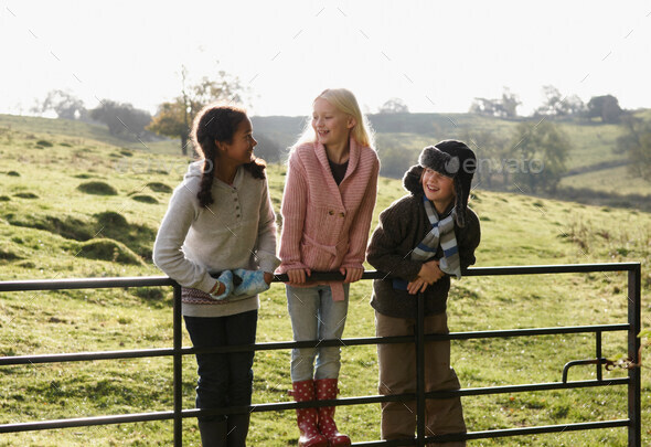 Children on gate in countryside Stock Photo by ImageSourceCur | PhotoDune