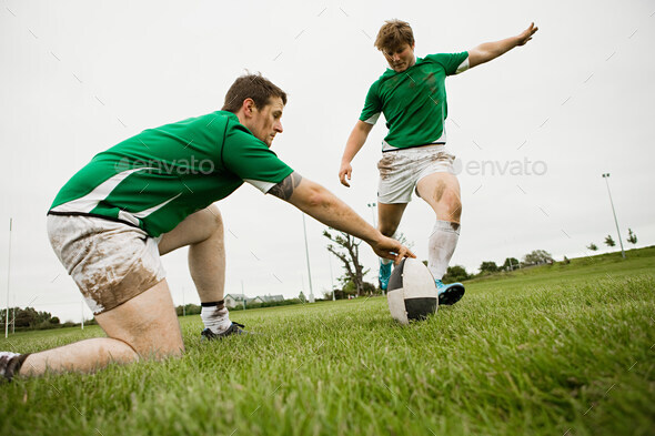 Rugby player kicking ball Stock Photo by nualaimages | PhotoDune