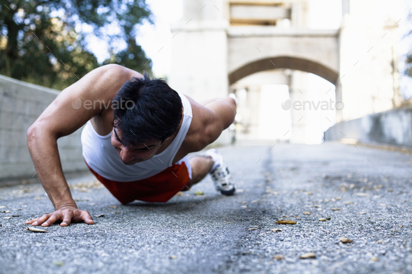 Man doing push ups on bridge, Arroyo Seco Park, Pasadena, California ...