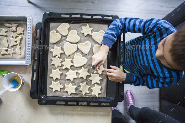 Young boy making cookies, overhead view Stock Photo by imagesourcecurated
