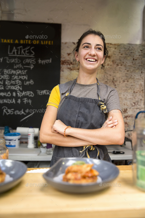 Portrait of female stall holder on cooperative food market stall Stock ...