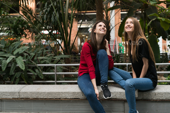 Pretty girls looking up Stock Photo by ADDICTIVE_STOCK | PhotoDune