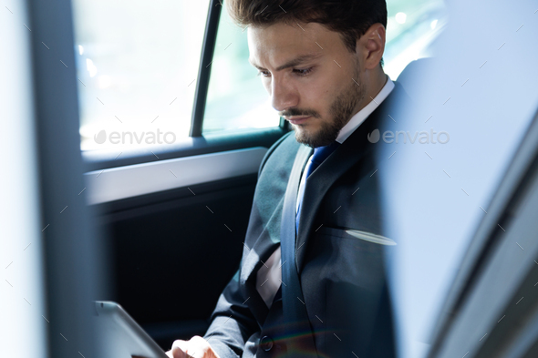 Man using laptop in car Stock Photo by ADDICTIVE_STOCK | PhotoDune