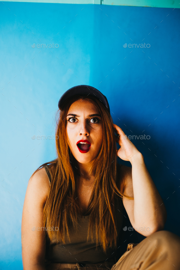 Smiling attractive lady in cap Stock Photo by ADDICTIVE_STOCK | PhotoDune