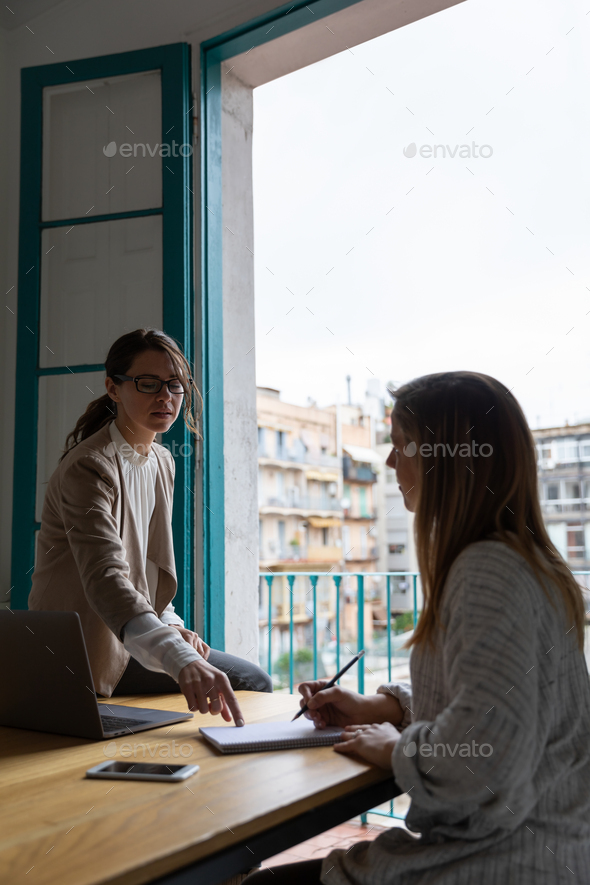 Female boss giving task to employee Stock Photo by ADDICTIVE_STOCK