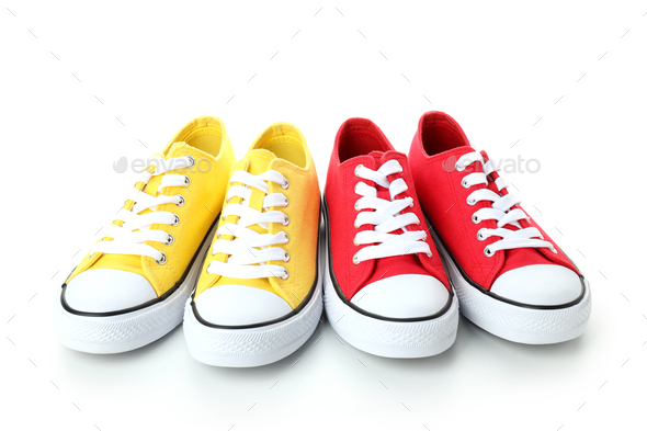 Pair of red and yellow sneakers isolated on white background Stock ...