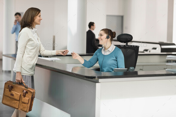 Receptionist Stock Photo by Image-Source | PhotoDune