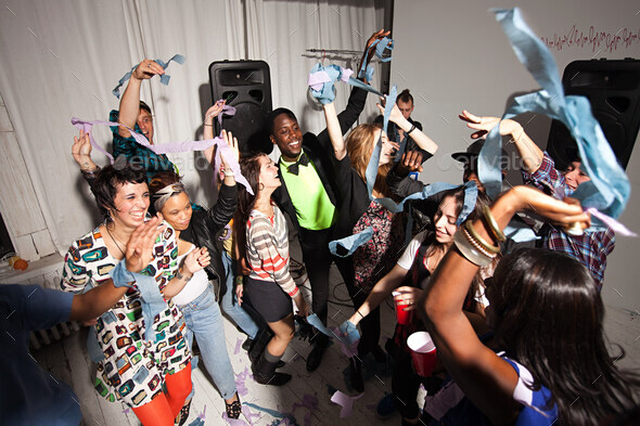 People dancing at party with streamers Stock Photo by Image-Source