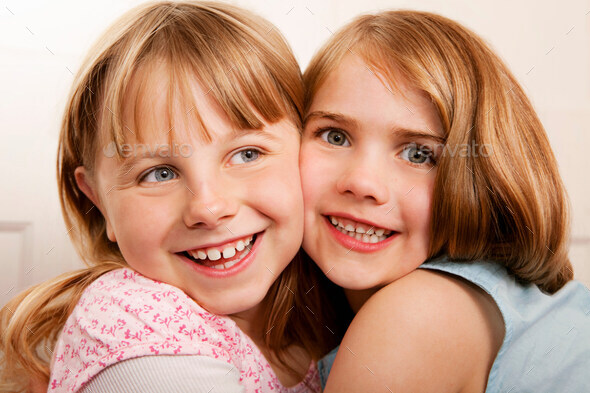 Portrait of two girls hugging Stock Photo by Image-Source | PhotoDune