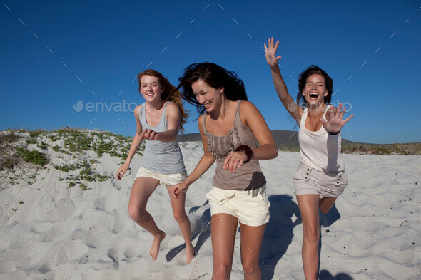 Three girls running towards camera Stock Photo by Image-Source | PhotoDune