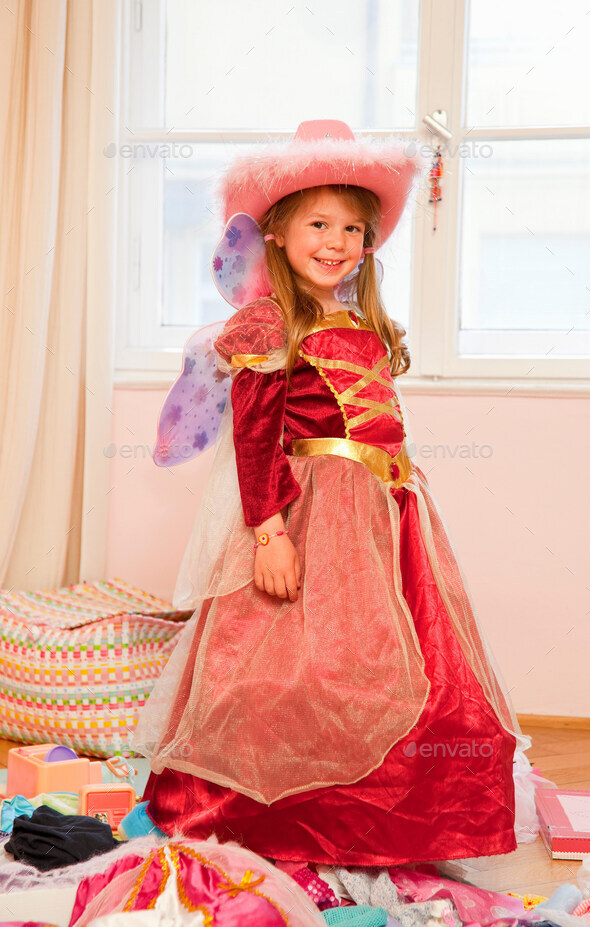 Smiling girl playing dress up Stock Photo by Image-Source | PhotoDune