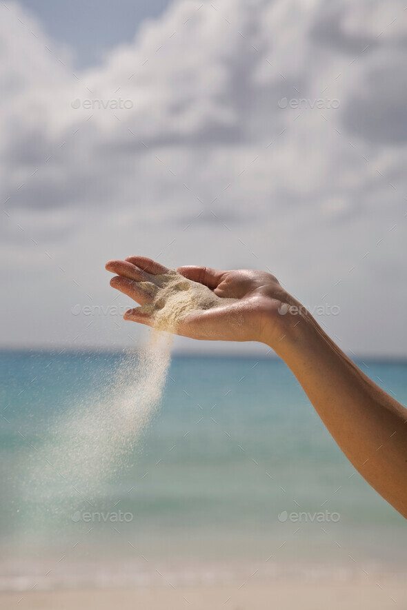 Sand Falling from Woman's Hand Stock Photo by Image-Source | PhotoDune